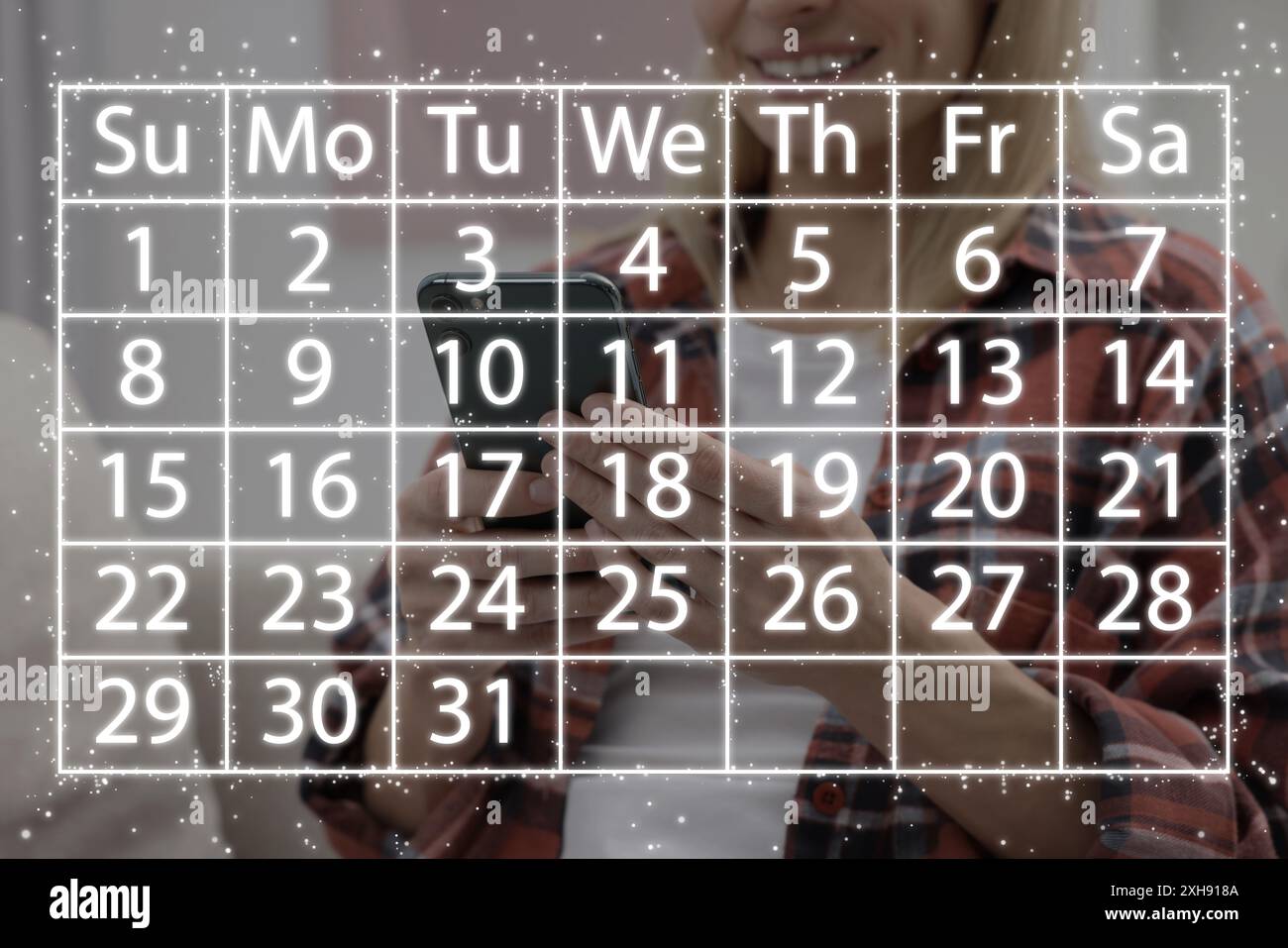 Woman making timetable in phone, closeup. Virtual calendar in ...