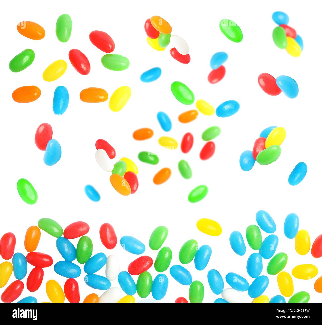 Many sweet jelly candies falling on white background Stock Photo - Alamy