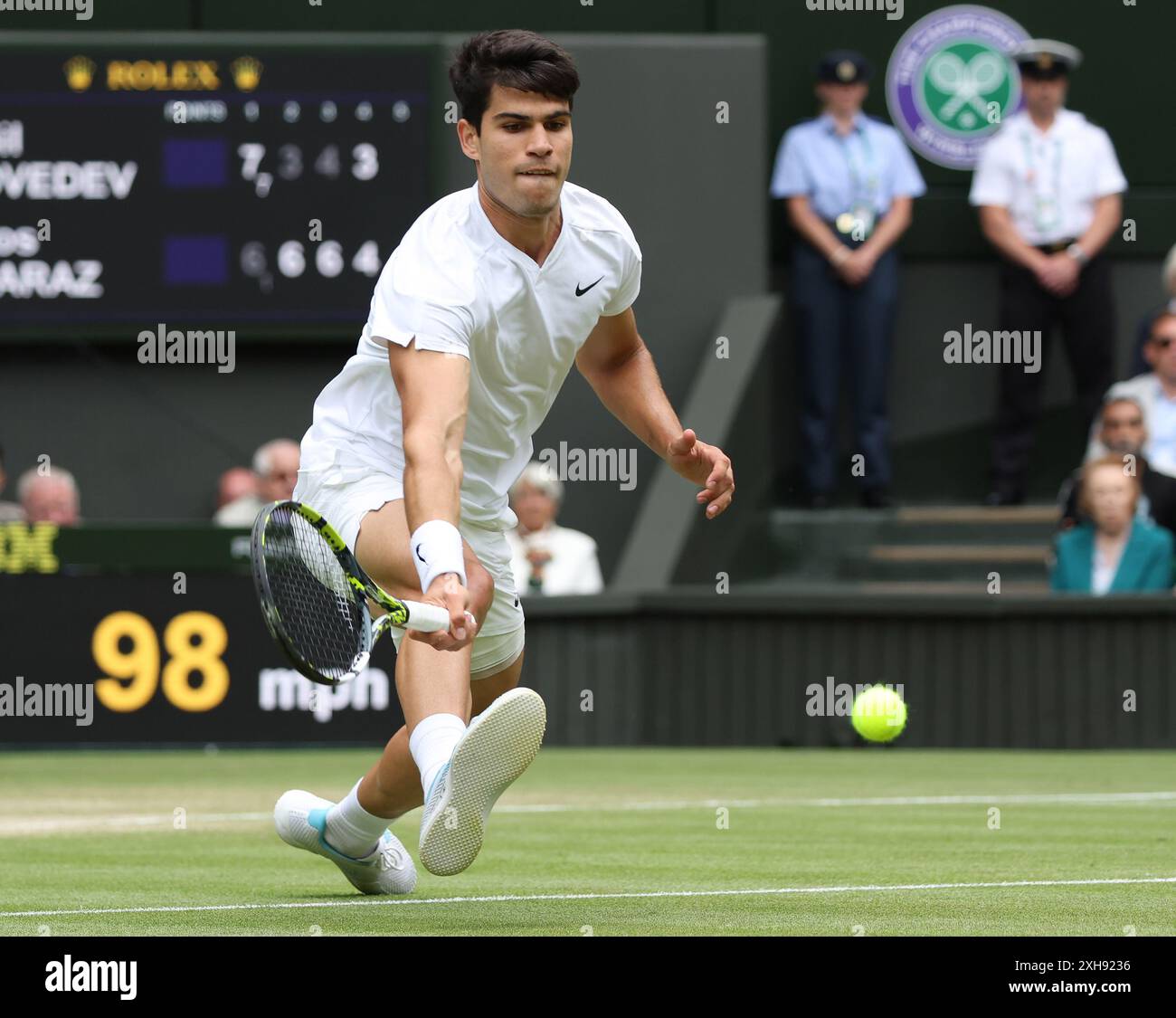 London, UK. 12th July, 2024. Carlos Alcaraz plays a forehand in his Men ...