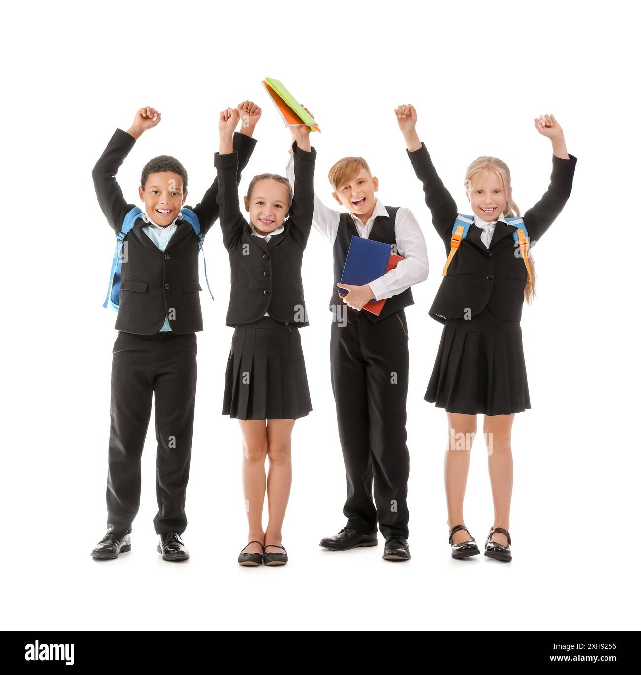 Little classmates in stylish uniform with backpacks and notebooks on ...
