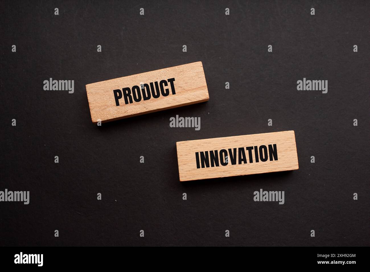Product innovation message written on wooden blocks with black ...