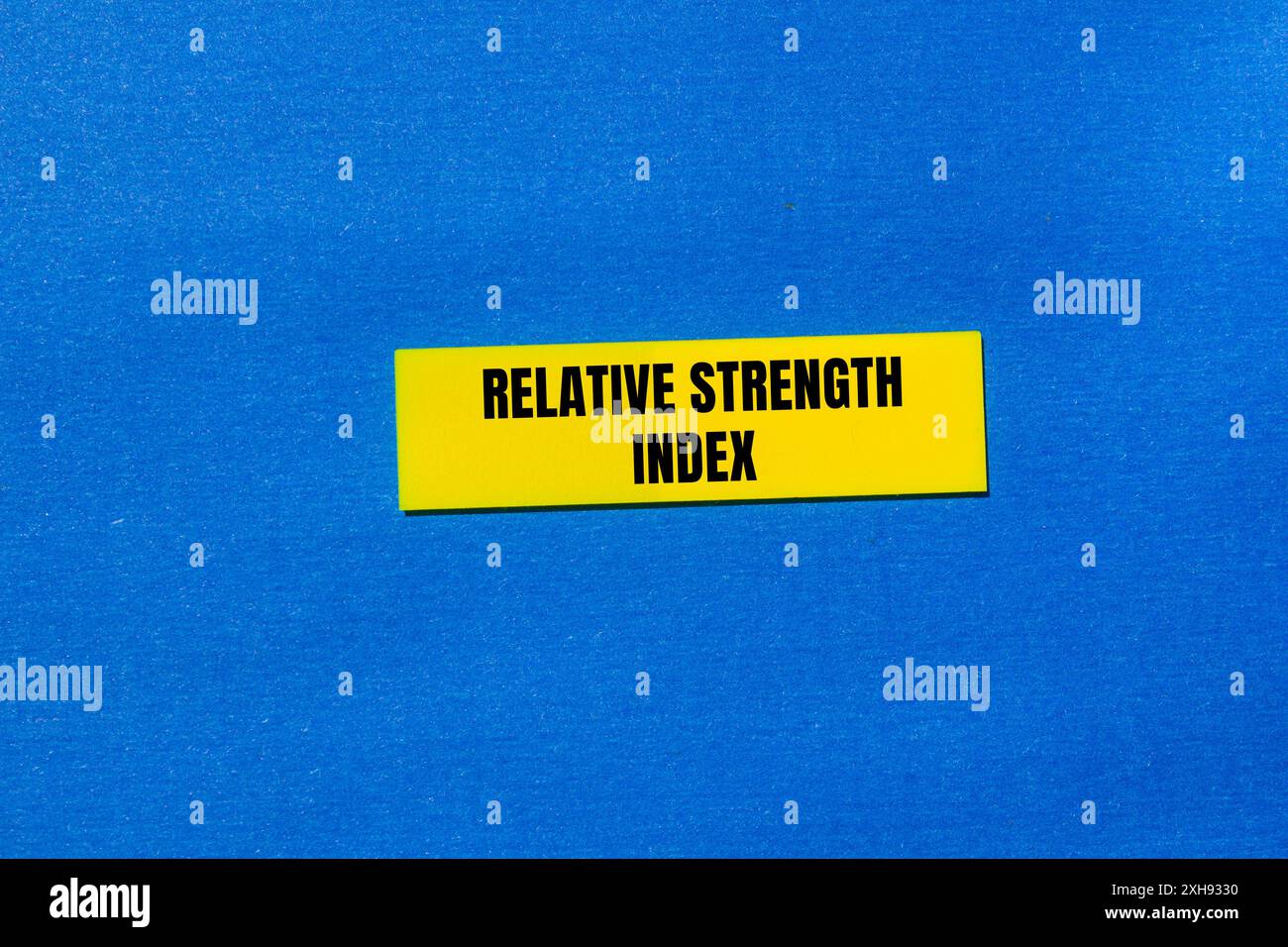 Relative strength index message written on yellow paper with blue ...