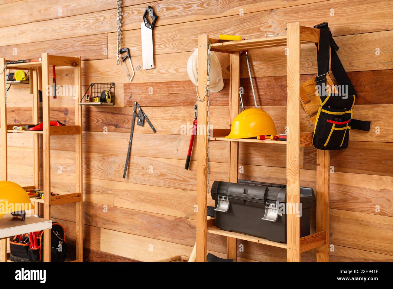 Interior of carpenter's workshop with different tools on shelves and ...