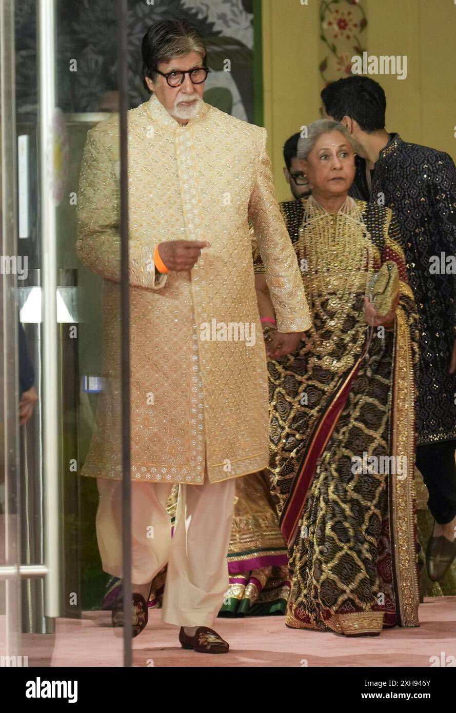Indian actor Amitabh Bachchan arrives with his wife Jaya Bachchan at the wedding of Billionaire ...