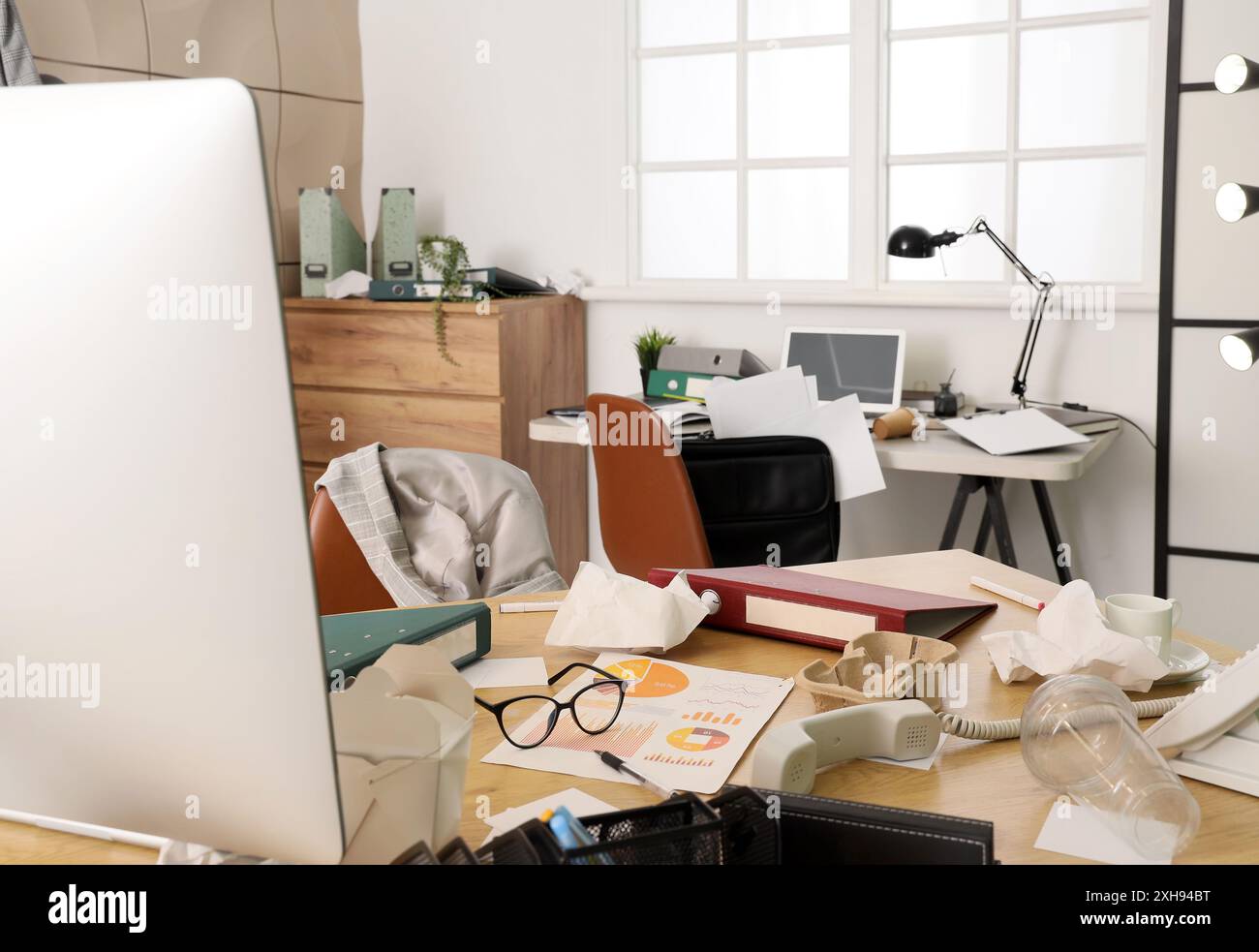 Messy workplace with garbage in office Stock Photo - Alamy