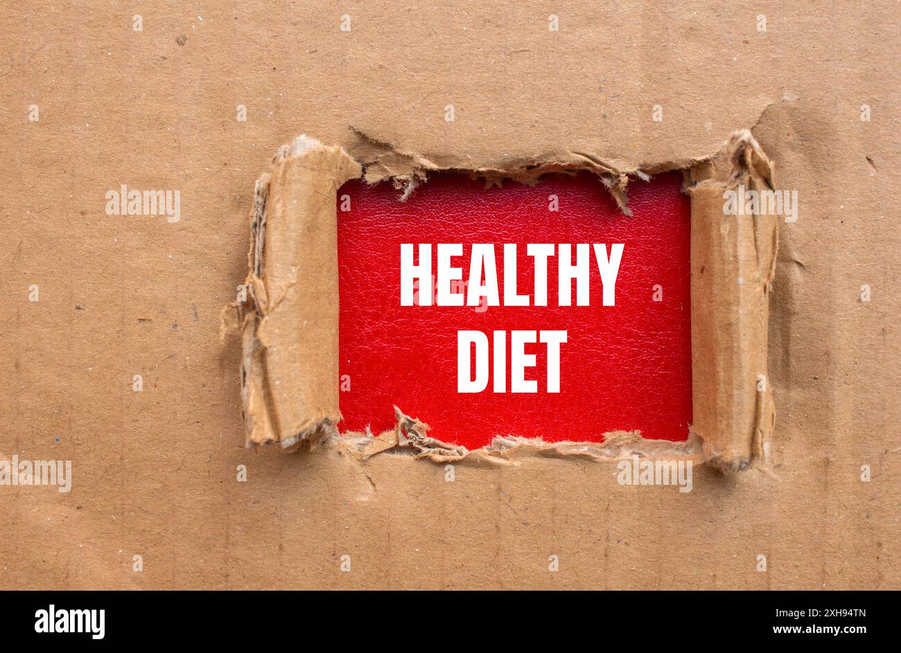 Healthy diet message written on ripped cardboard paper with red ...