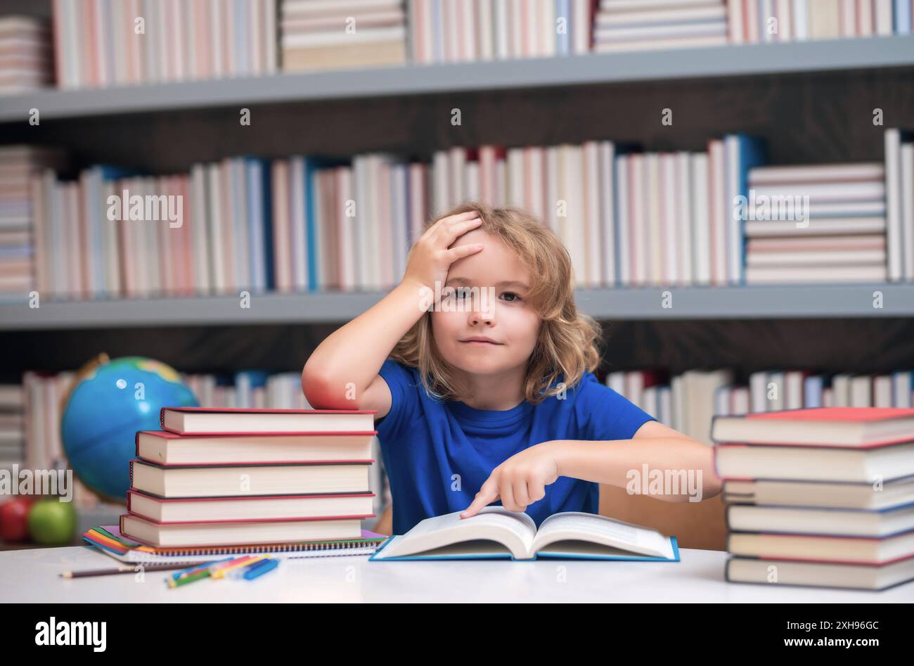 Knowledge and education school concept. School boy pupil reading book ...