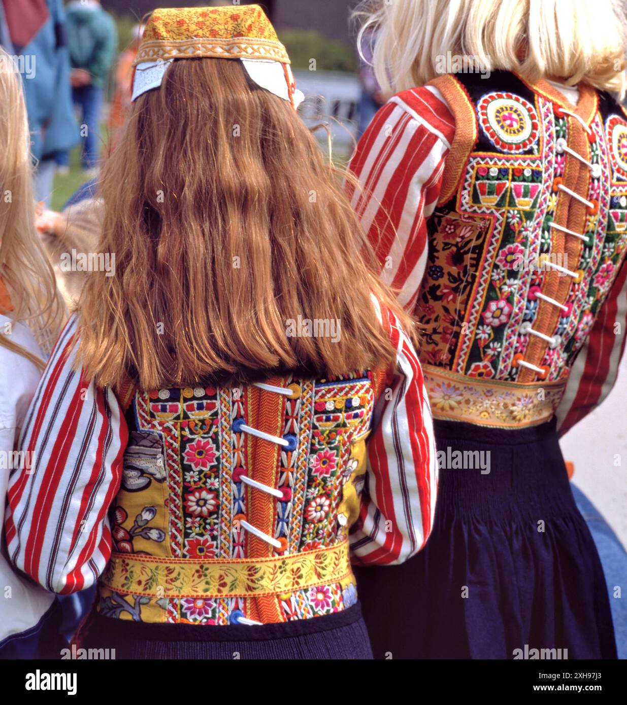 Two girls in traditional costume at Marken, Holland. At Kingsday people ...
