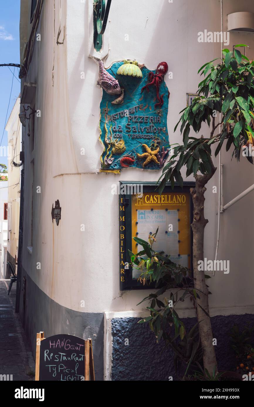 Capri, Italy Pizza Restaurant sign with seafood artistic display on a ...