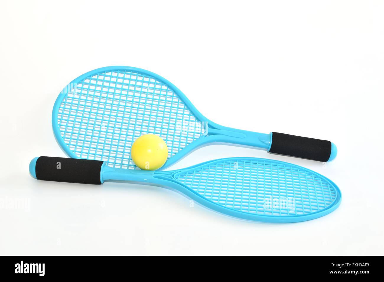 Children's tennis rackets of blue color and a yellow ball Stock Photo ...