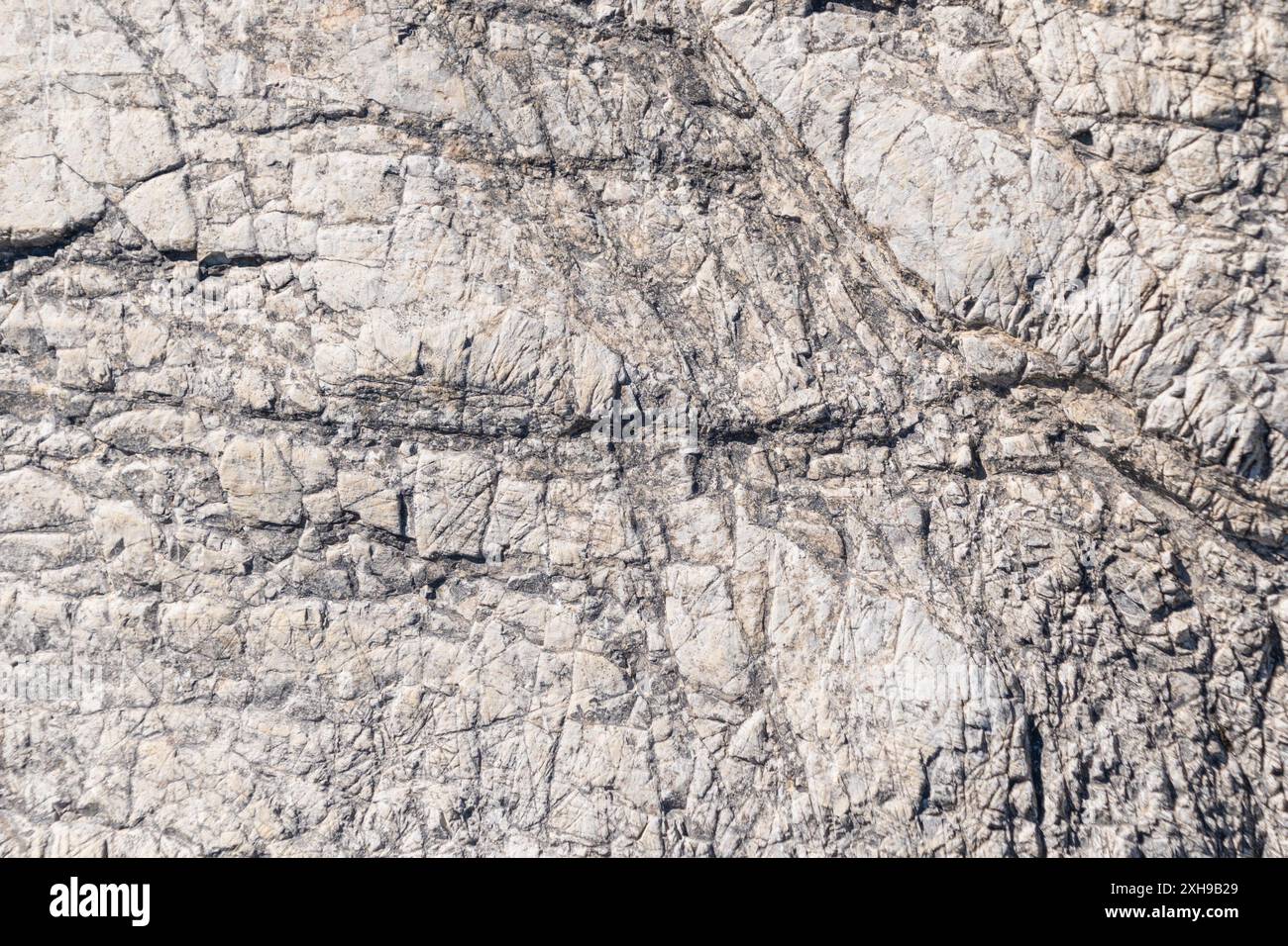 Stone cliff in the mountains, close-up. Natural stone background ...