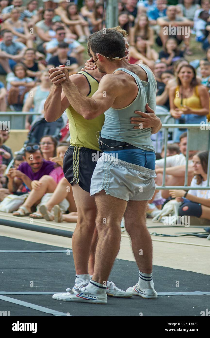 Viladecasn, SPAIN - JULY 12, 2024: This image captures two athletes in ...
