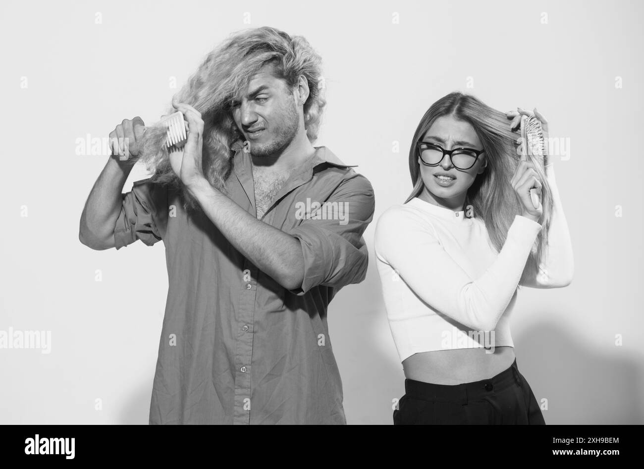 Messy hair. Couple of young woman and man with messed hairs. Bad frizzy ...