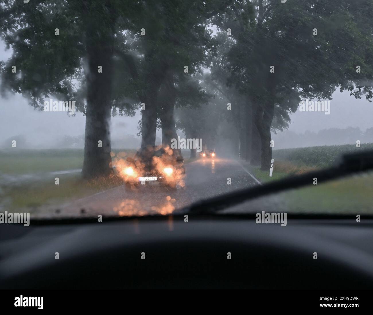 Sieversdorf, Germany. 12th July, 2024. Heavy rainfall obstructs traffic ...