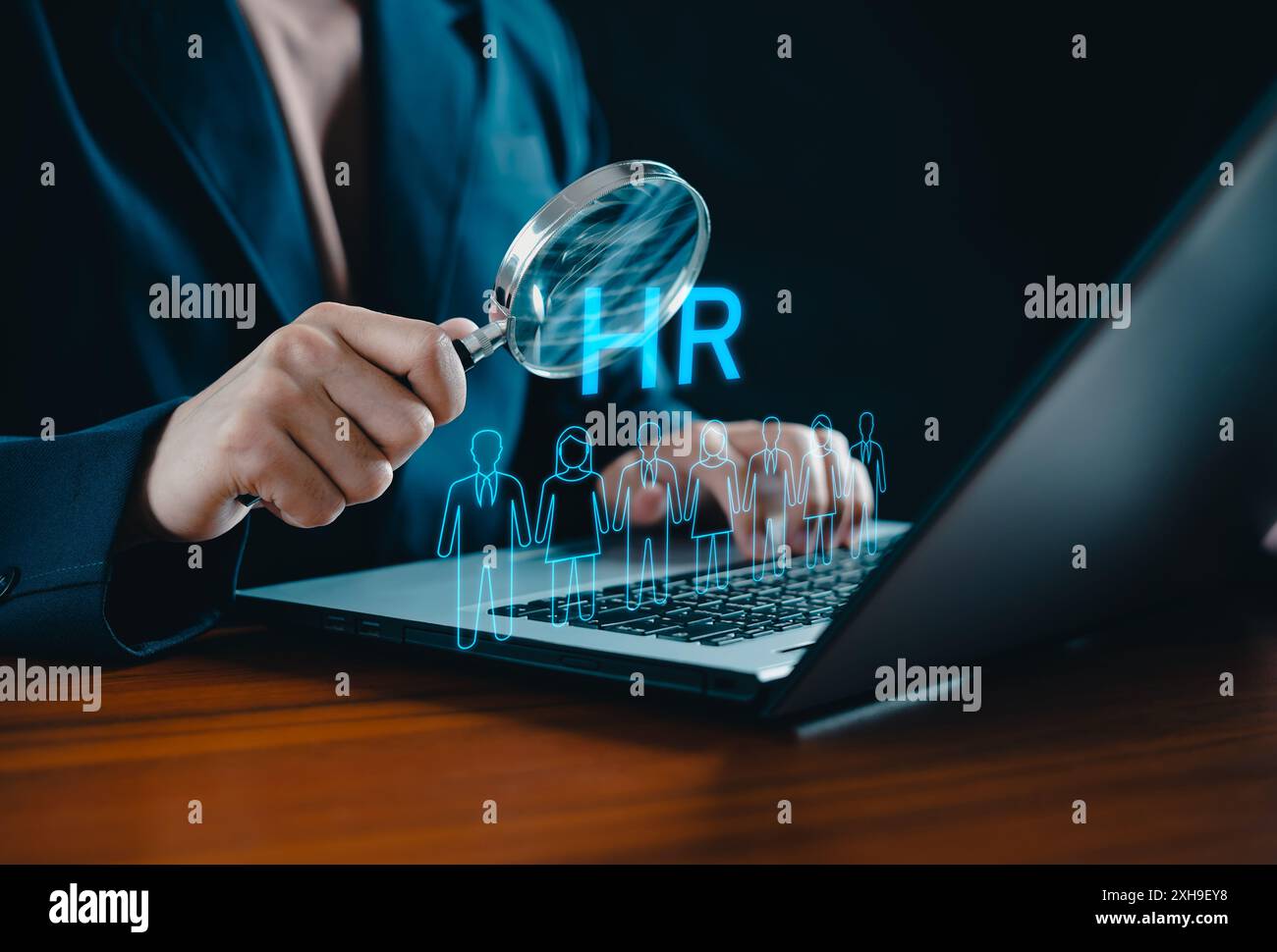 Human Resource Management concept. HRM. Businessman holding magnifier for searching to human ...