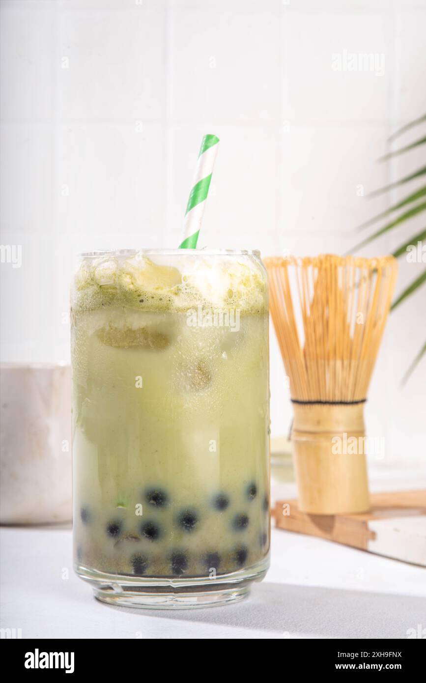 Green matcha boba bubble tea with tapioca pearl. Trendy asian cold iced ...