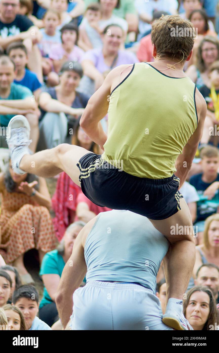 Viladecasn, SPAIN - JULY 11, 2024: Two athletes showcase skill and ...