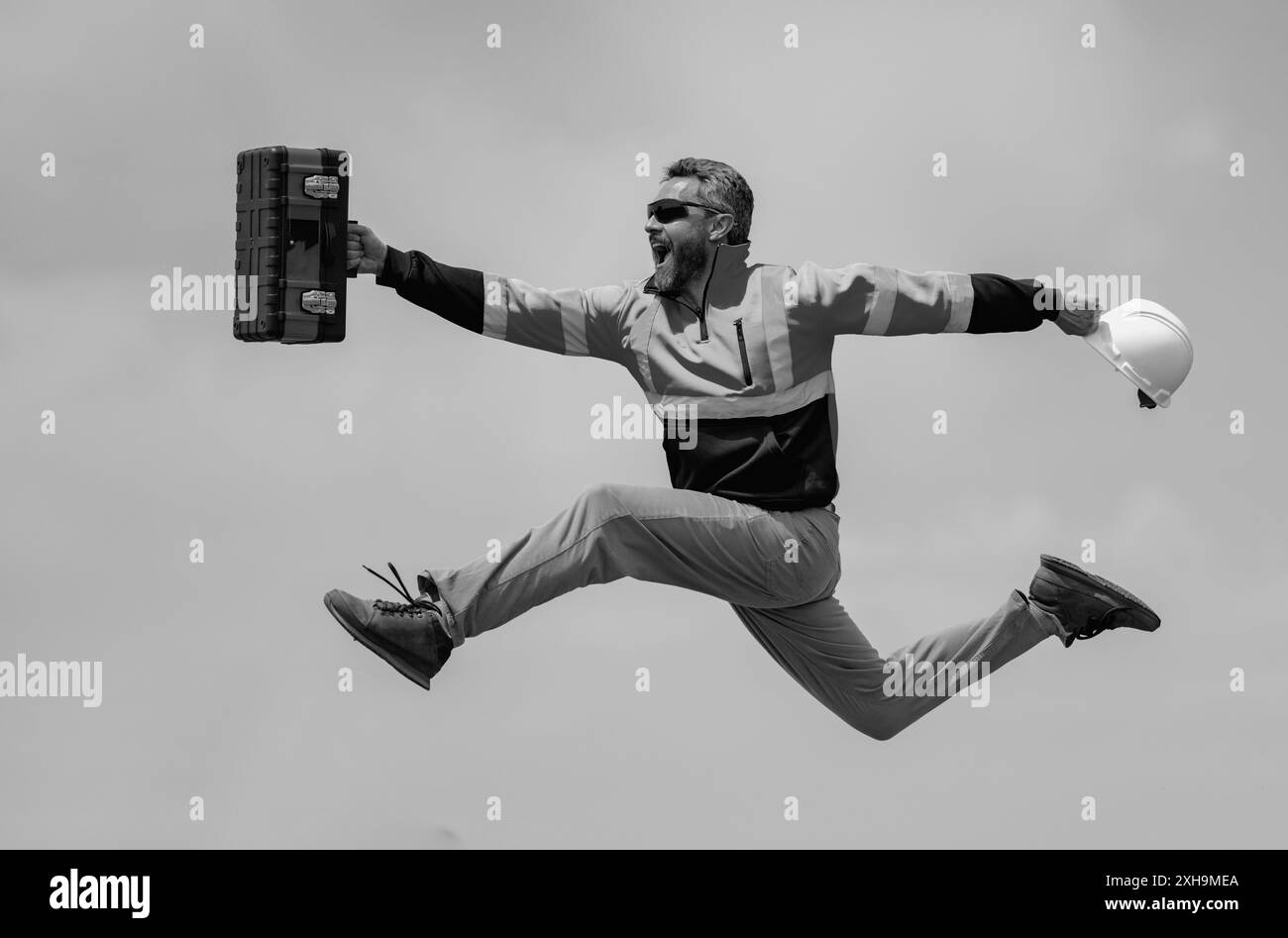 Crazy builder excited jump on site construction. Excited builder ...