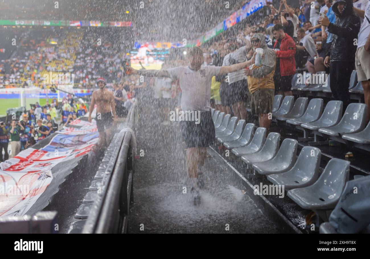 Dortmund, Germany. 10th Jul 2024. England fans have fun under a ...