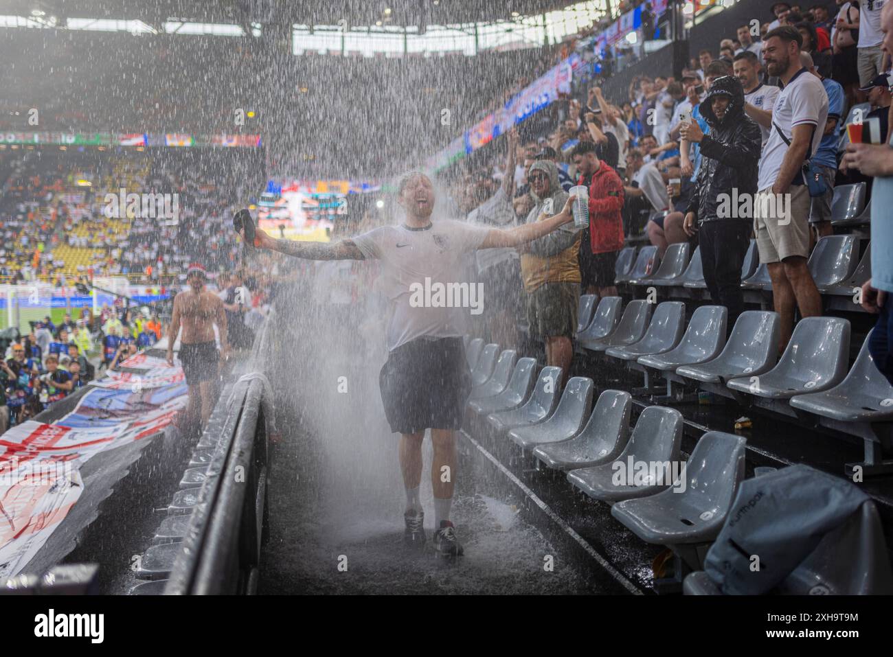 Dortmund, Germany. 10th Jul 2024. England fans have fun under a ...