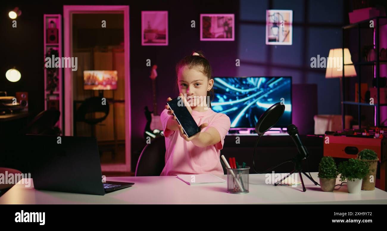 Young child filming in living room used as professional studio for ...