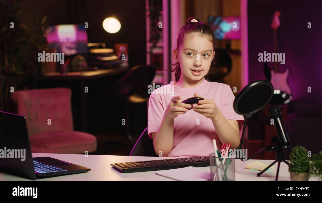 Kid content creator filming keyboard review in home studio, pressing ...