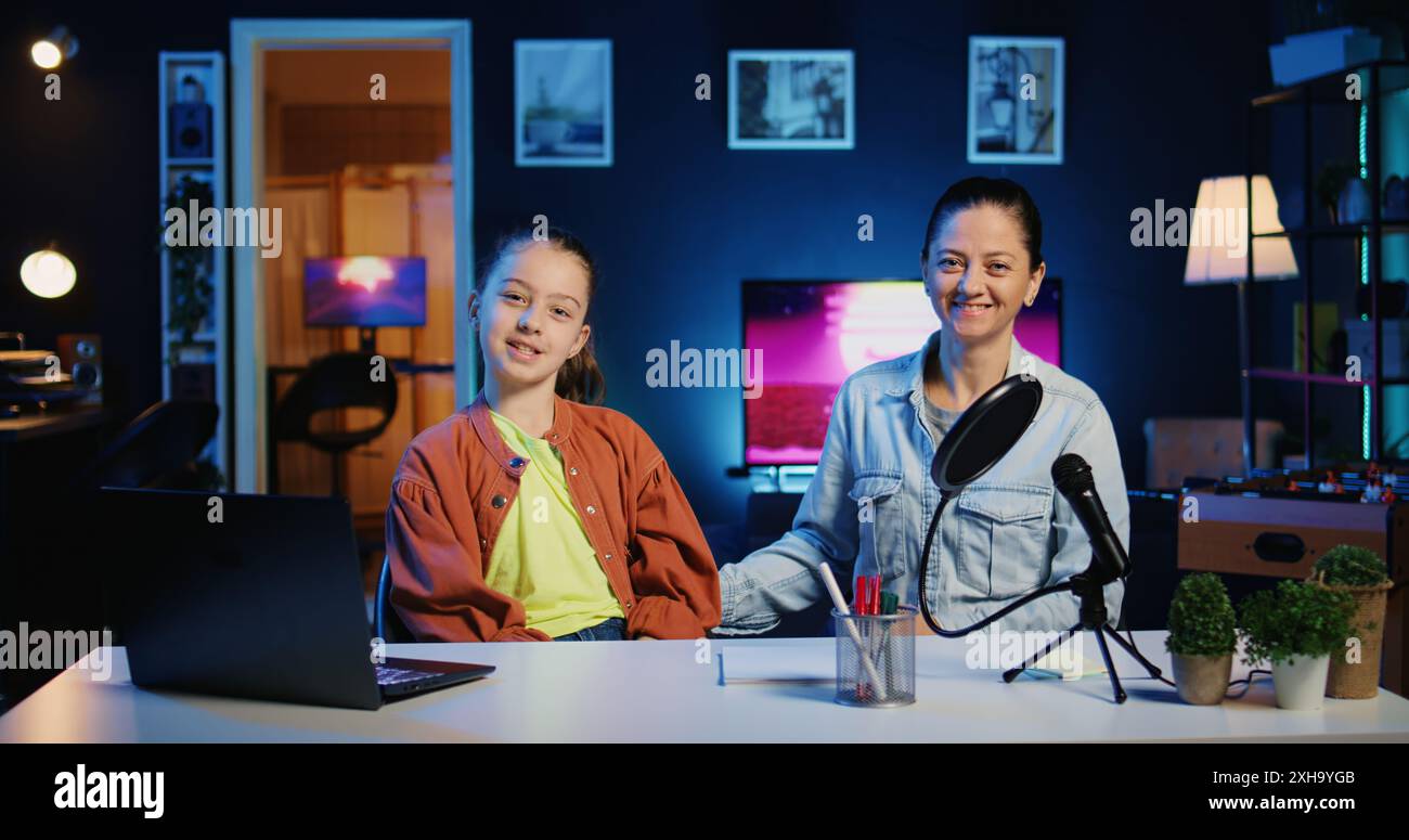 Tired child filming with professional gear in living room used as ...