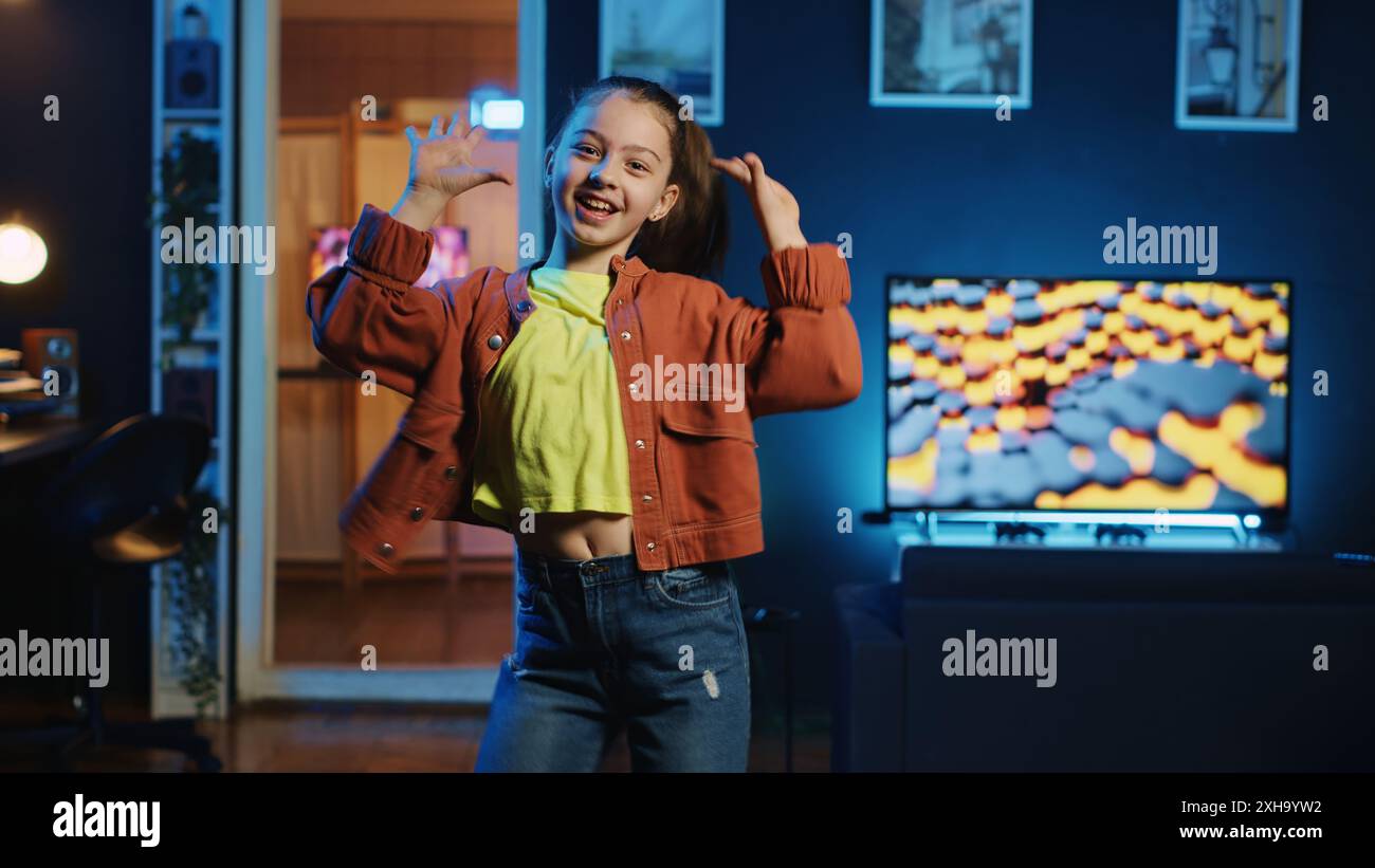 Kid influencer having fun dancing in home studio, recording video for ...