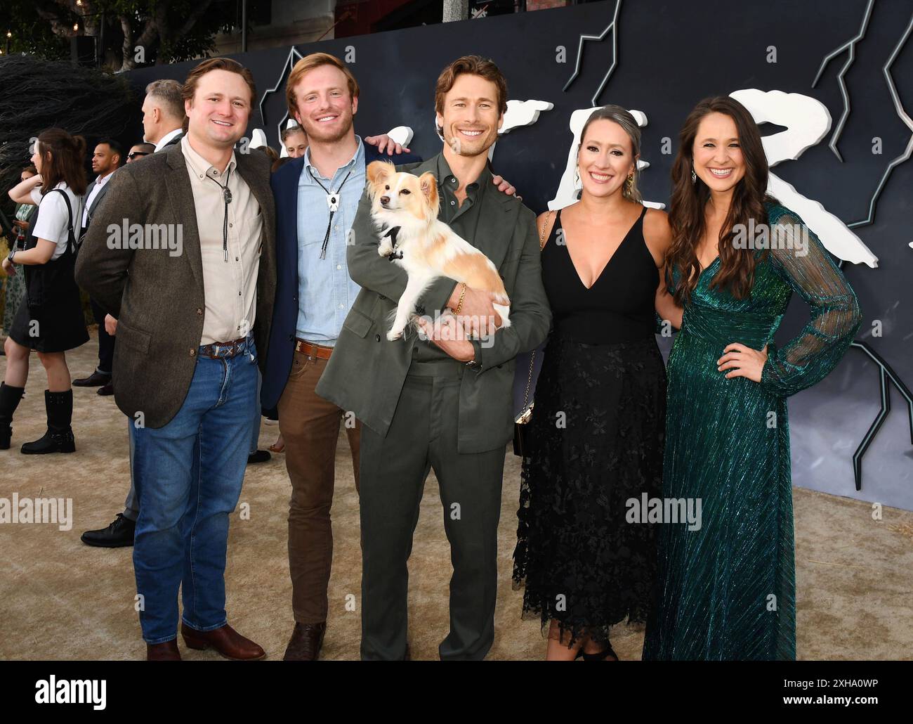 LOS ANGELES, CALIFORNIA - JULY 11: Glen Powell (C) and family attend ...