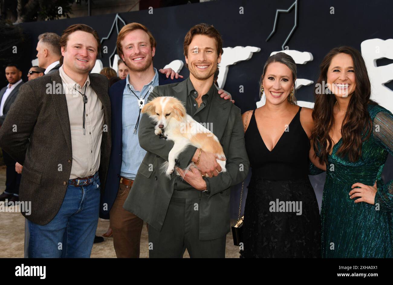LOS ANGELES, CALIFORNIA - JULY 11: Glen Powell (C) and family attend ...