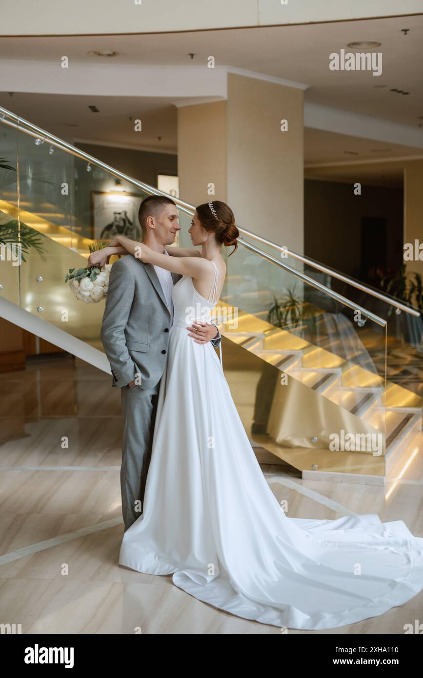 first meeting of the bride and groom on the hotel stairs Stock Photo ...