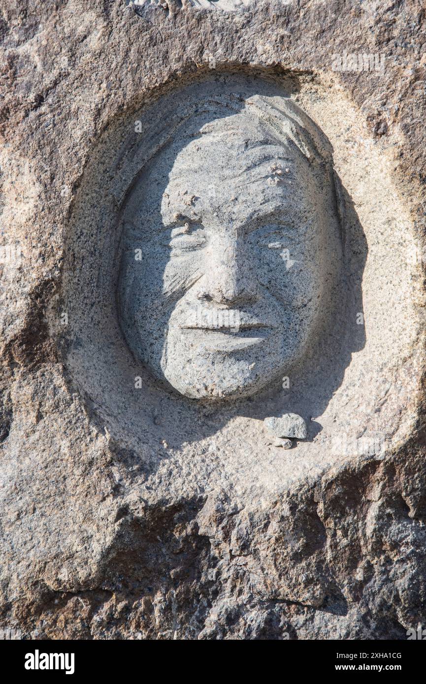 Sculpture of Inuit faces at the Legislative Assembly of Nunavut on ...