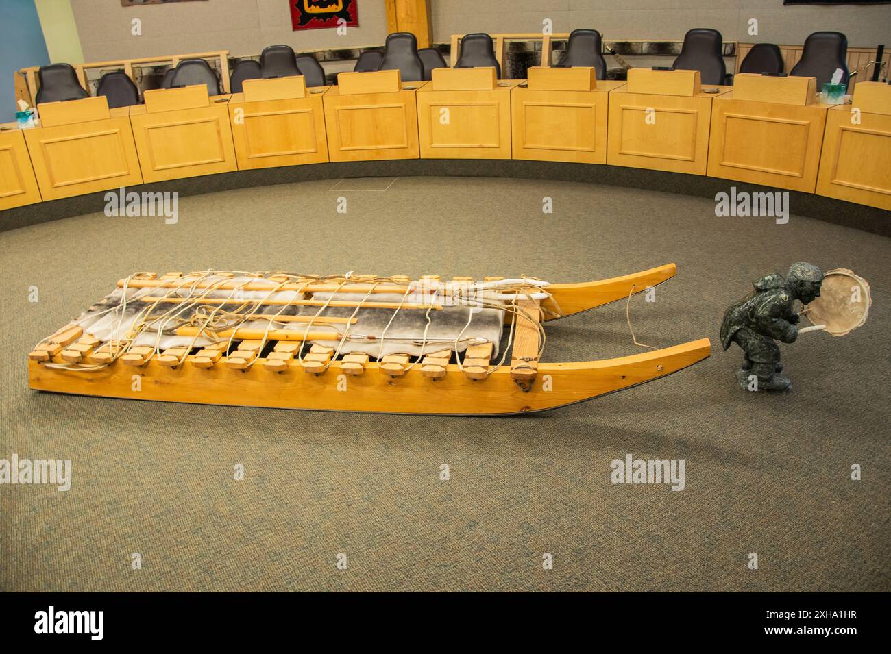 Inuit stone sculpture figurine pulling a qamutiik in the chambers at ...