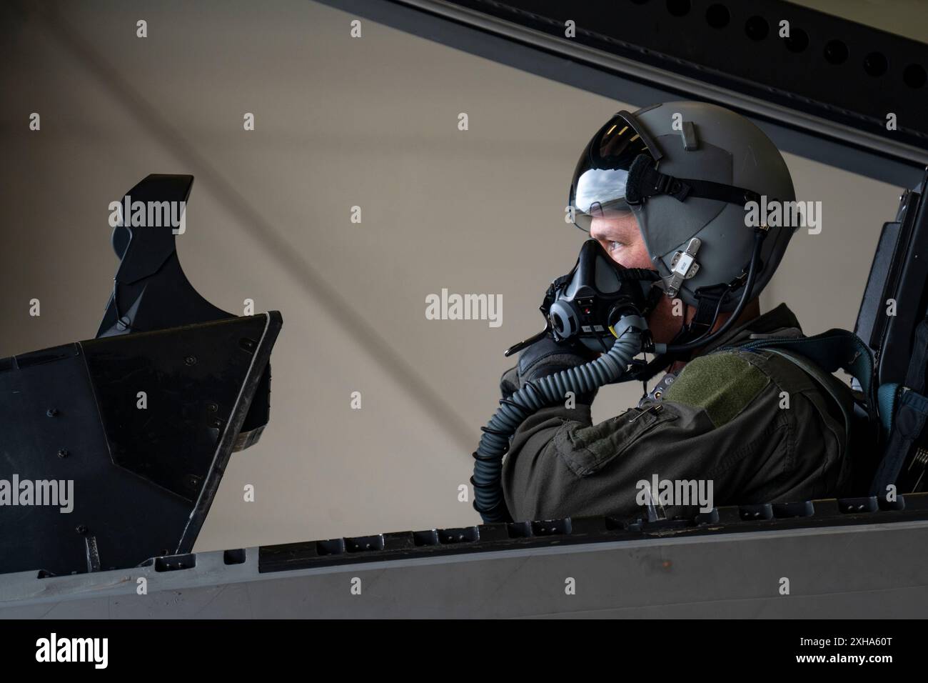 U.S. Air Force Col. Kevin Jamieson dons his flight helmet prior to his ...