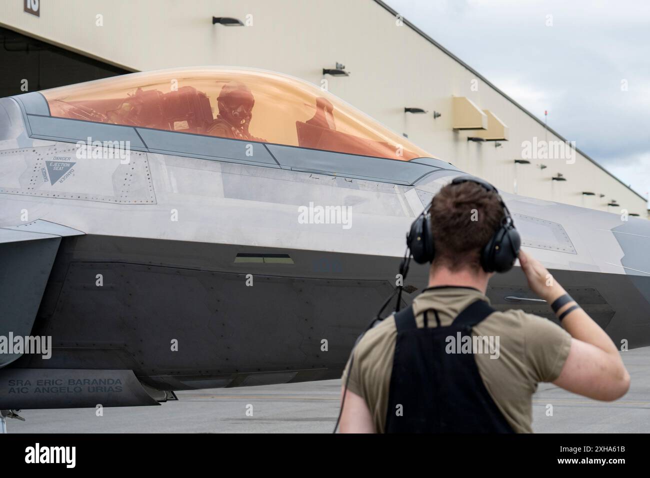 U.S. Air Force Col. Kevin Jamieson receives a salute from Airman 1st ...