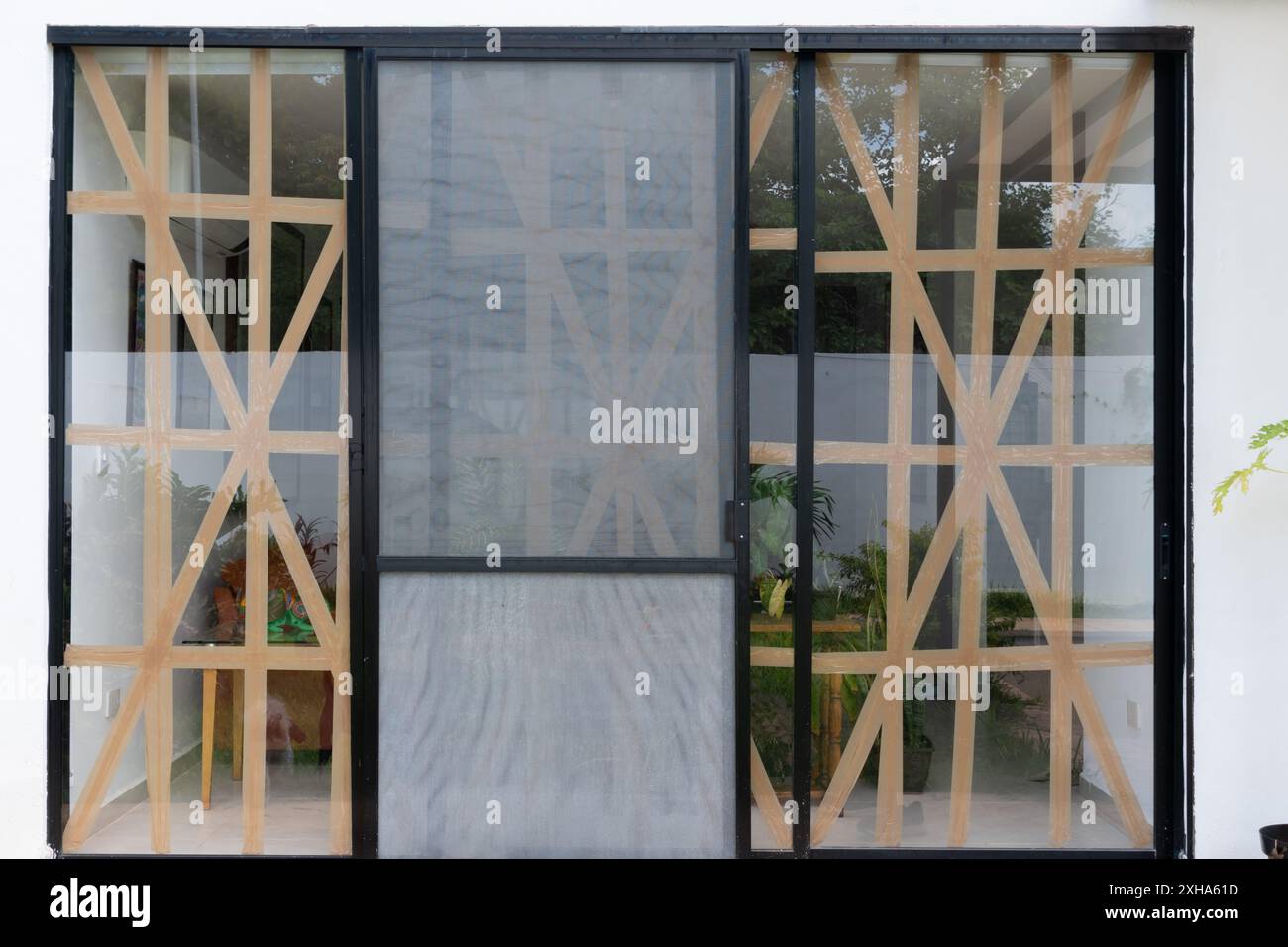 adhesive tape stuck on the windows of a house, in the shape of a star ...