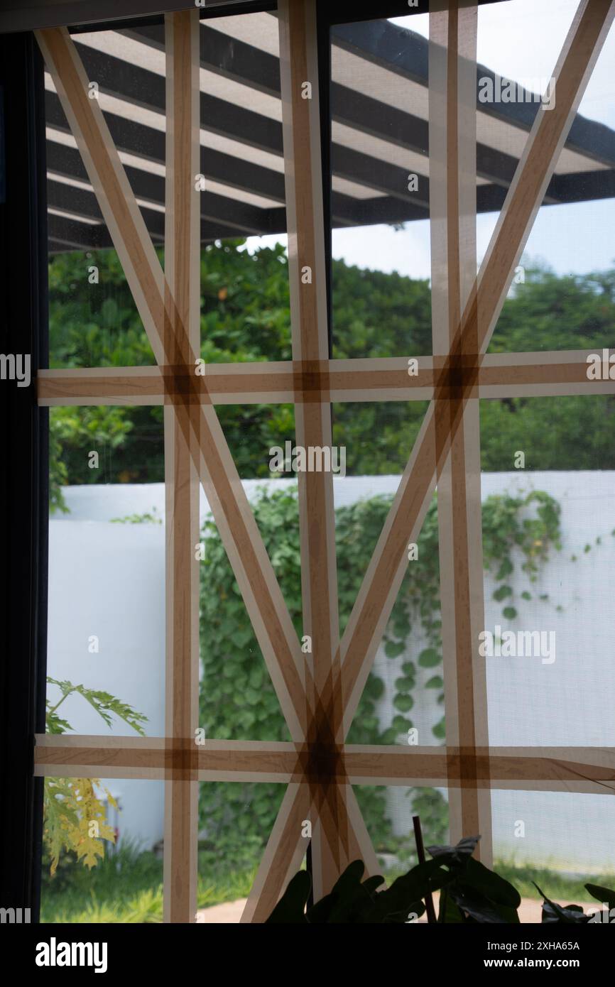 adhesive tape stuck on the windows of a house, in the shape of a star ...