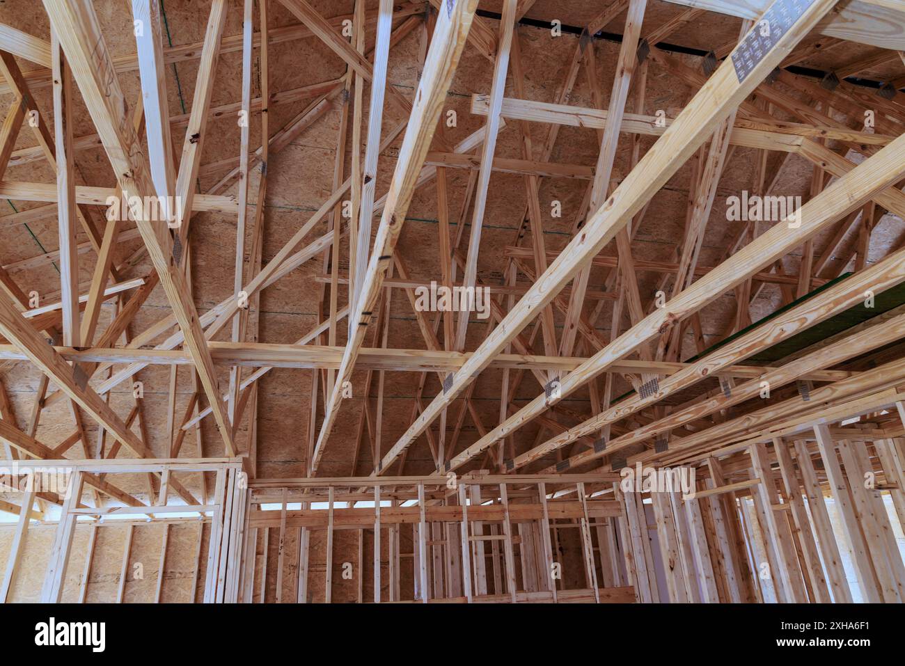 House with wooden framework frame is being constructed with support ...