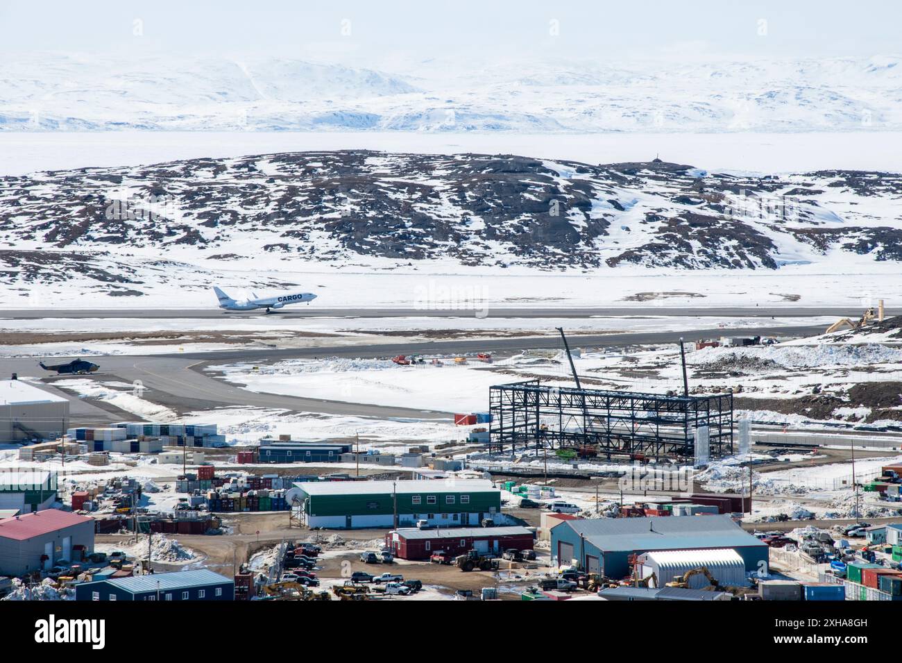 Cargo airplane taking off over Frobisher Bay in Iqaluit, Nunavut ...