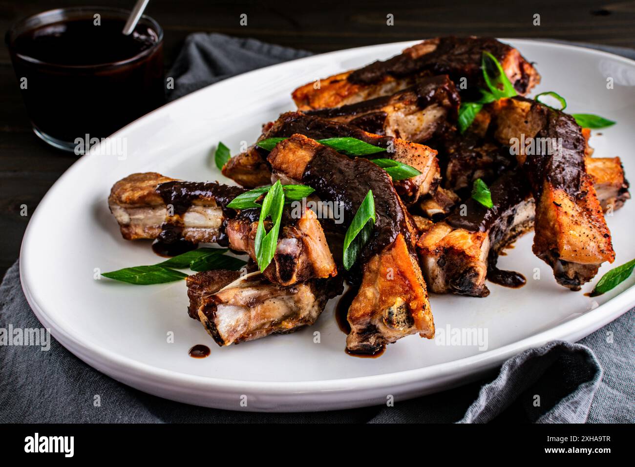 Pork Ribs with Black Garlic-Miso Sauce on a Serving Plate: Platter of ...