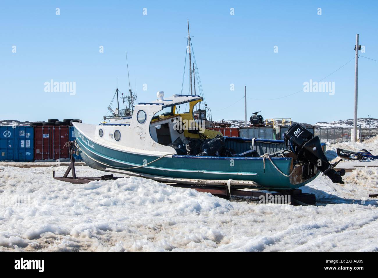 Our Lady Franki boat stored on the beach on Frobisher Bay in Iqaluit, Nunavut, Canada Stock ...