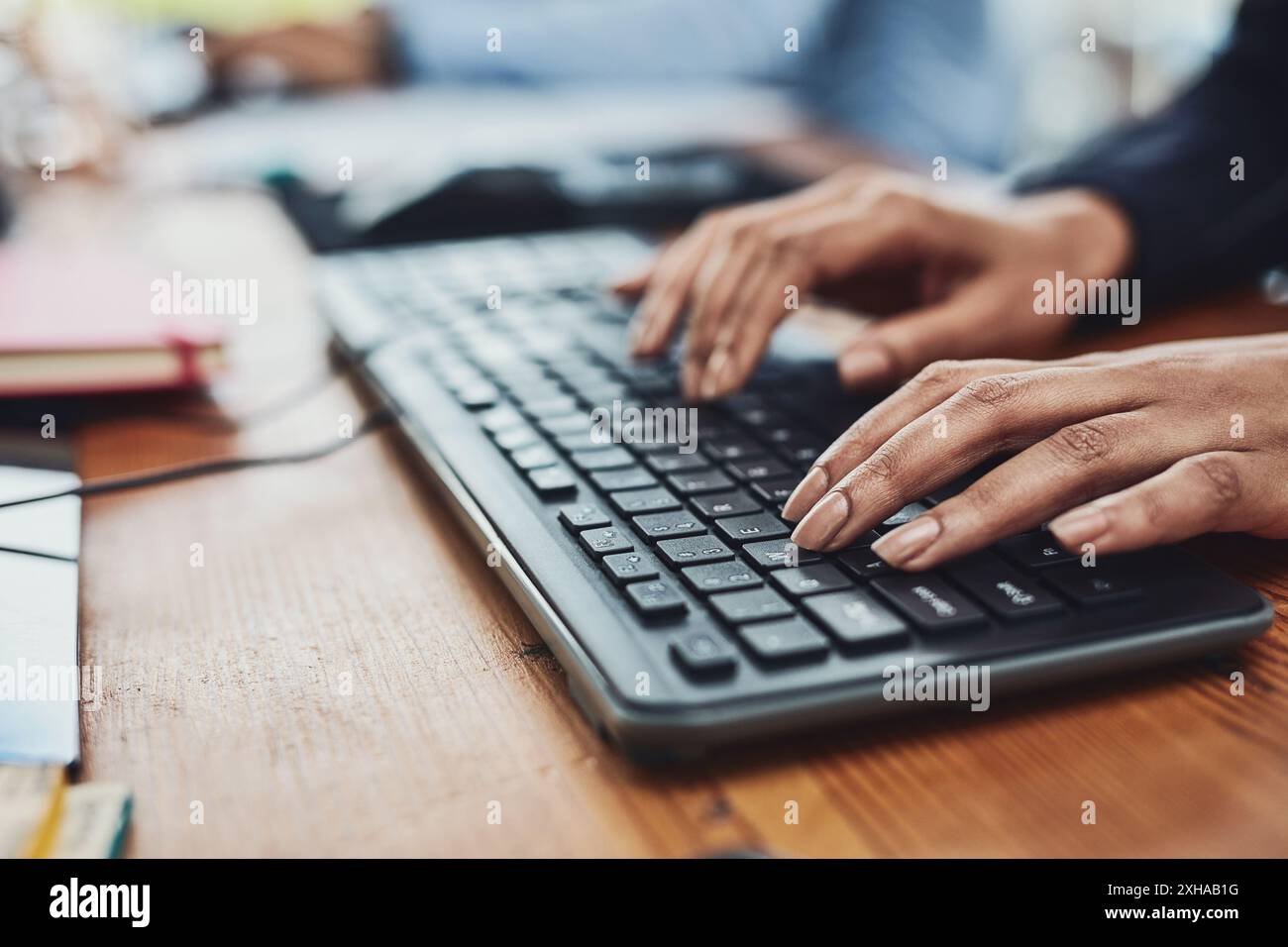 Hands, keyboard and typing in office with person, computer and editing ...