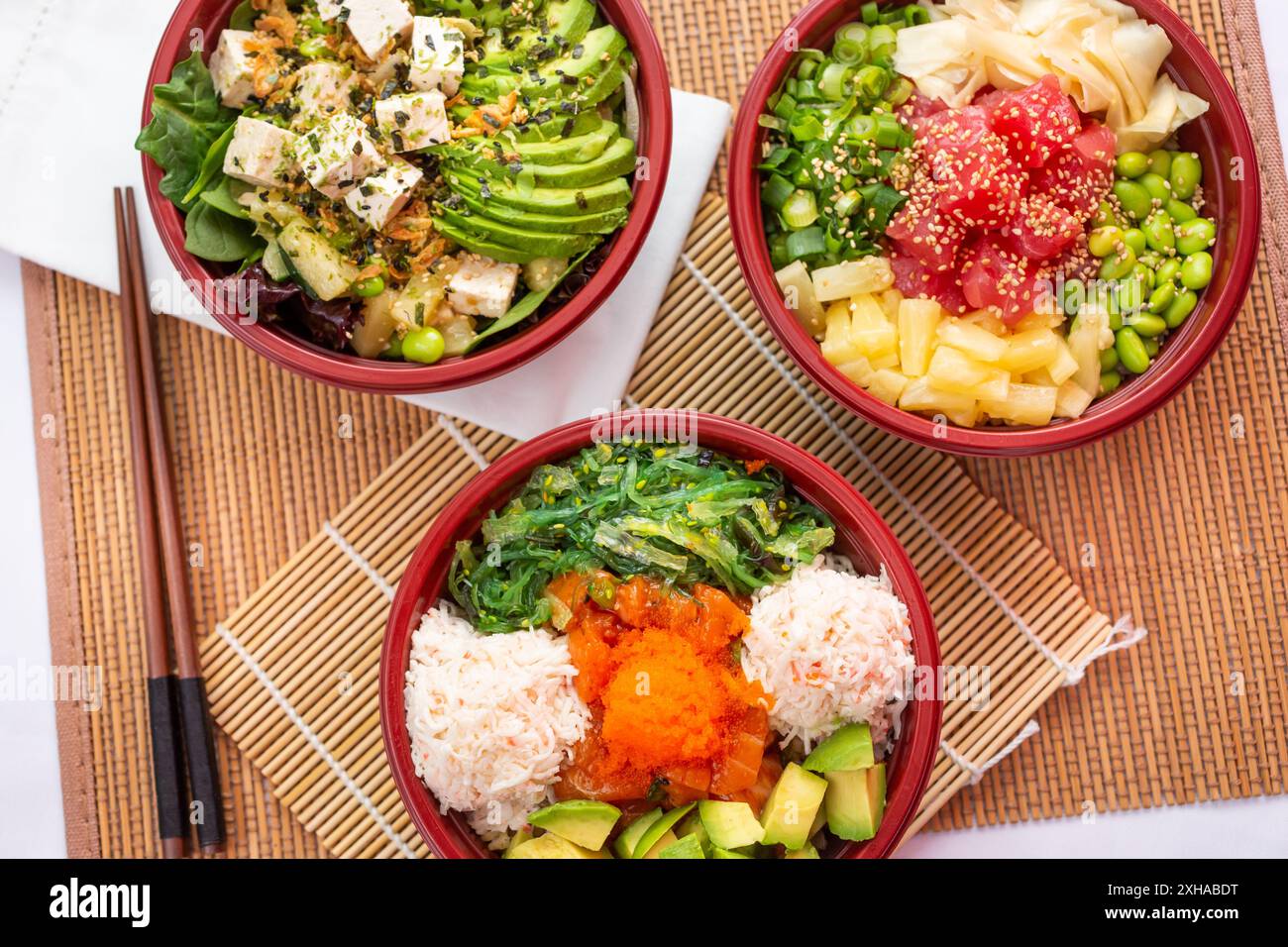 A top down view of several varieties of poke bowls Stock Photo - Alamy