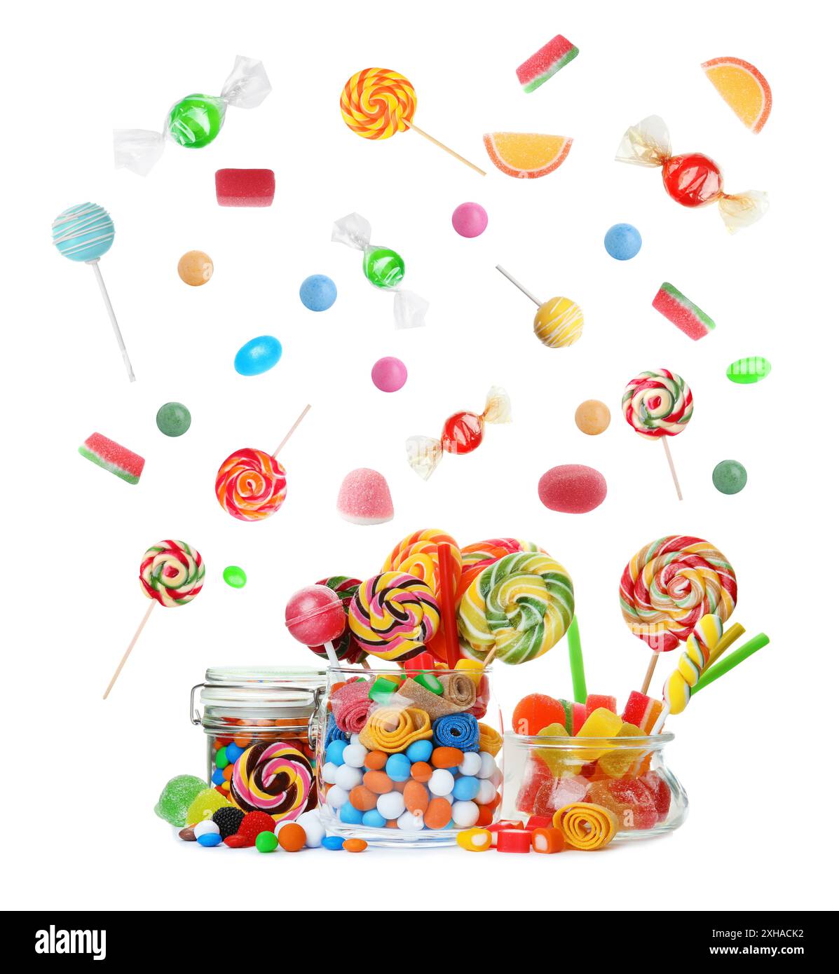 Different sweet candies falling on white background Stock Photo - Alamy