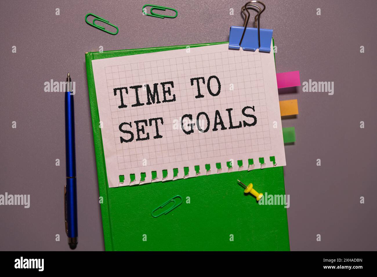 TIME TO SET GOALS text written on a notebook on grey background with ...