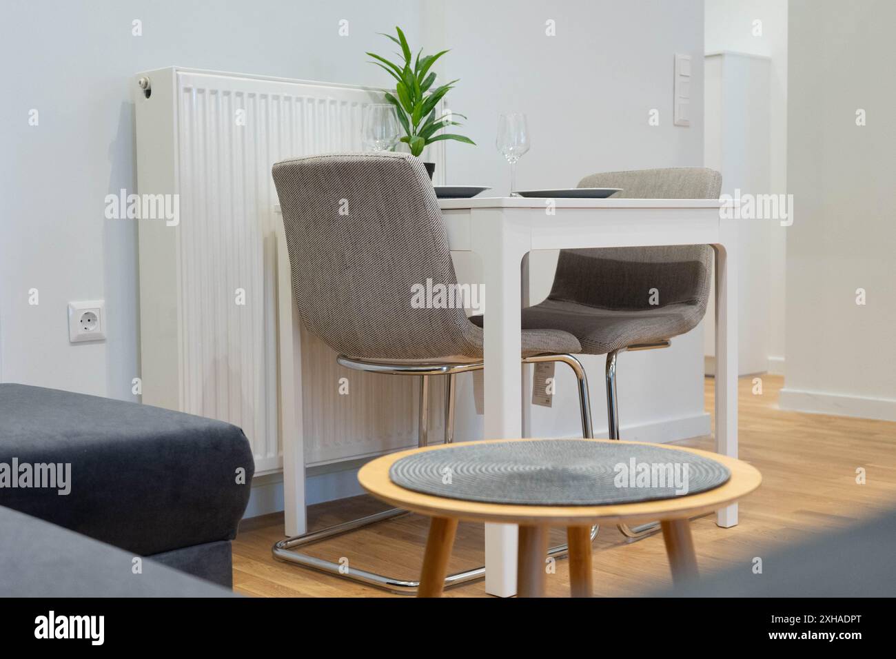 Couch in an apartment, airbnb. View of clean white walls, coffee table ...