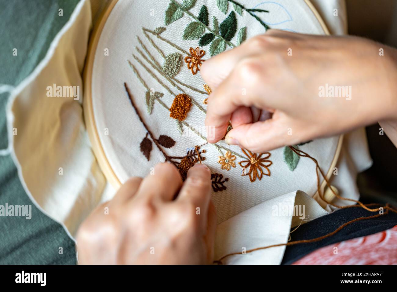 Woman's hands working on embroidery with thread and needle Stock Photo ...