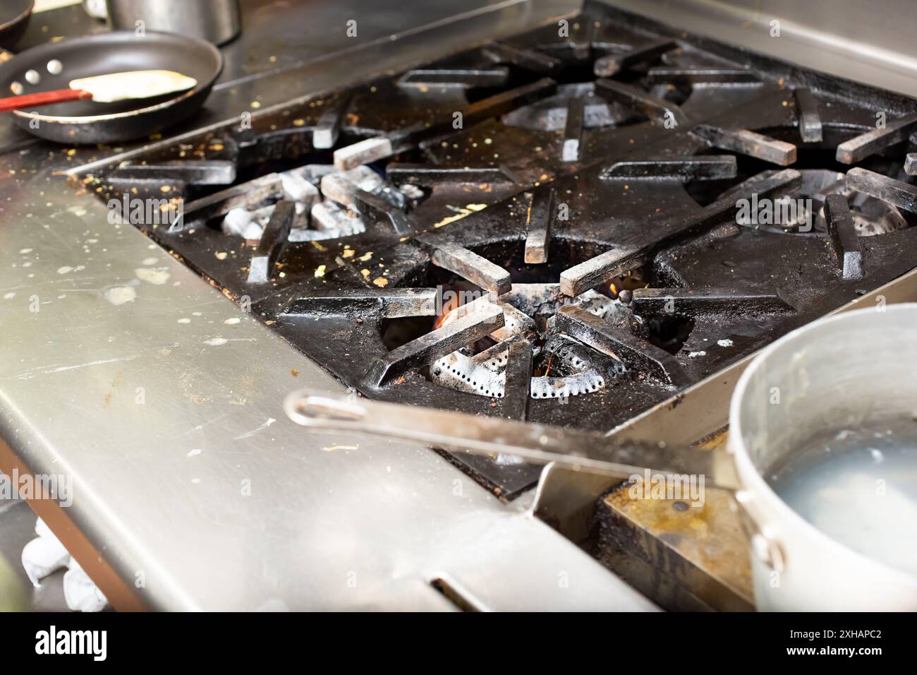 A view of a restaurant kitchen grade stove and its burners Stock Photo ...