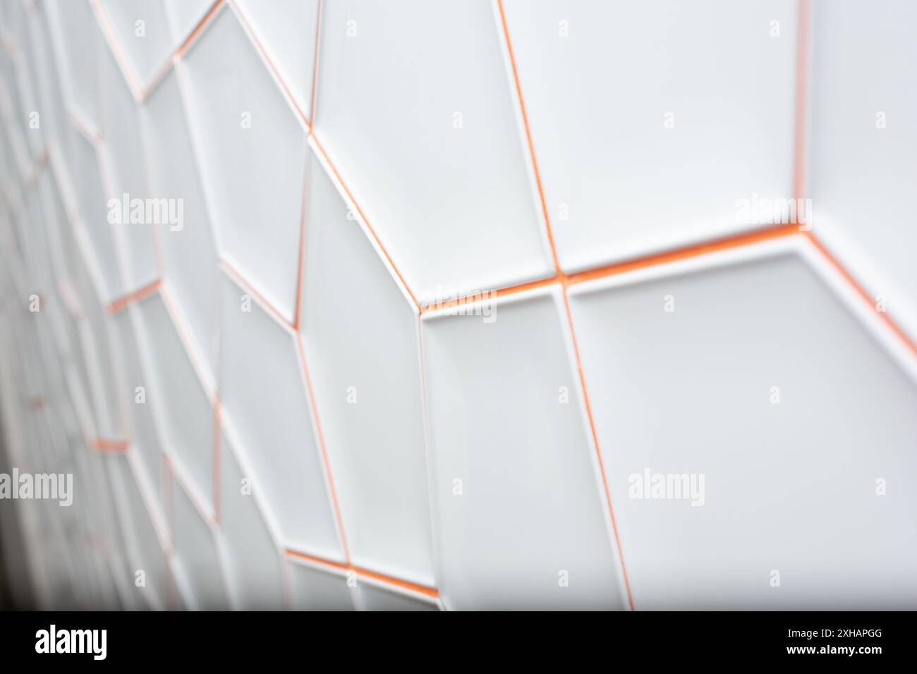 A closeup angled view of a wall background of pentagon shaped tile ...