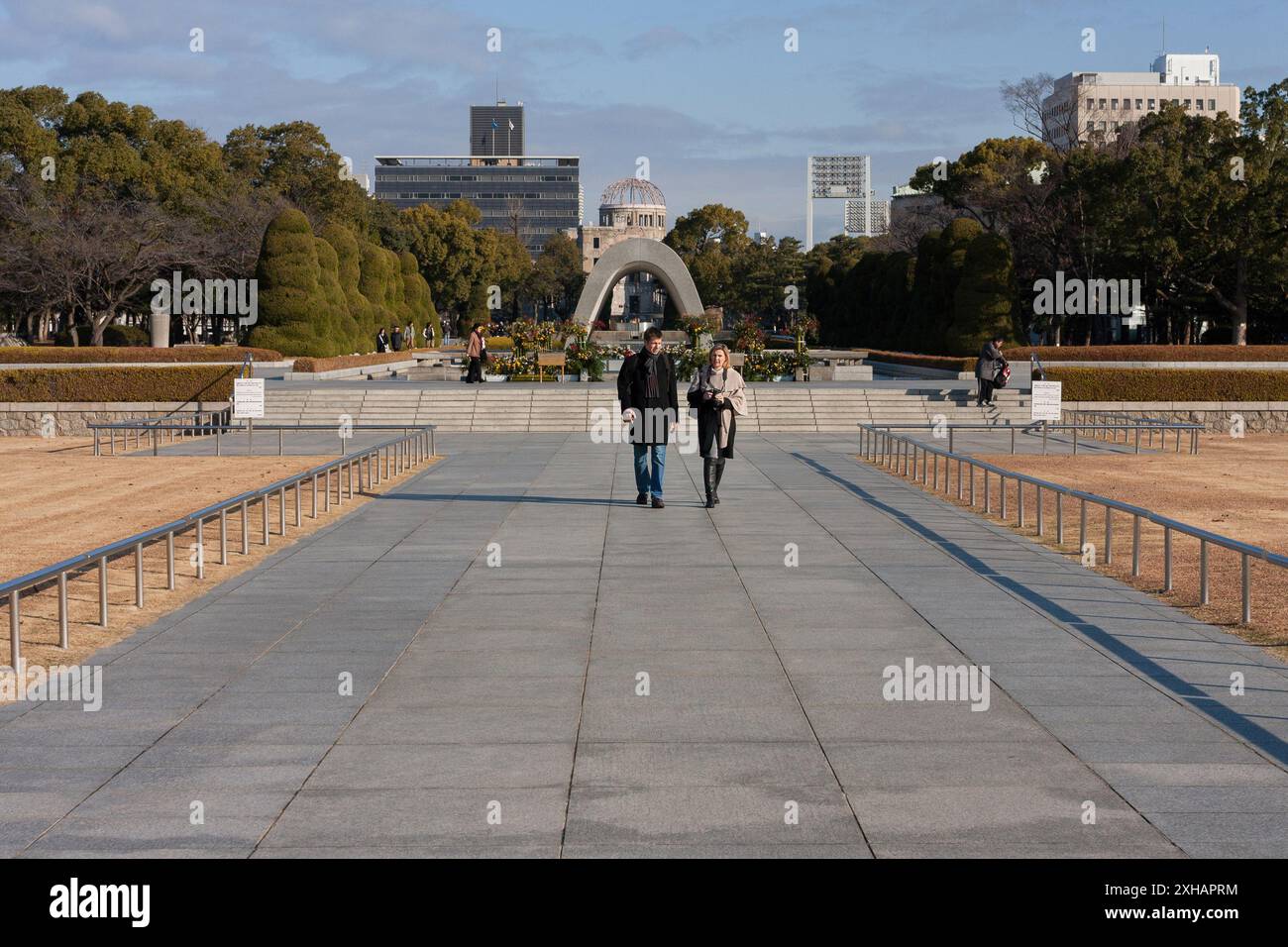 Western tourists walk towards the Atomic Bomb Museum in Hiroshima with ...